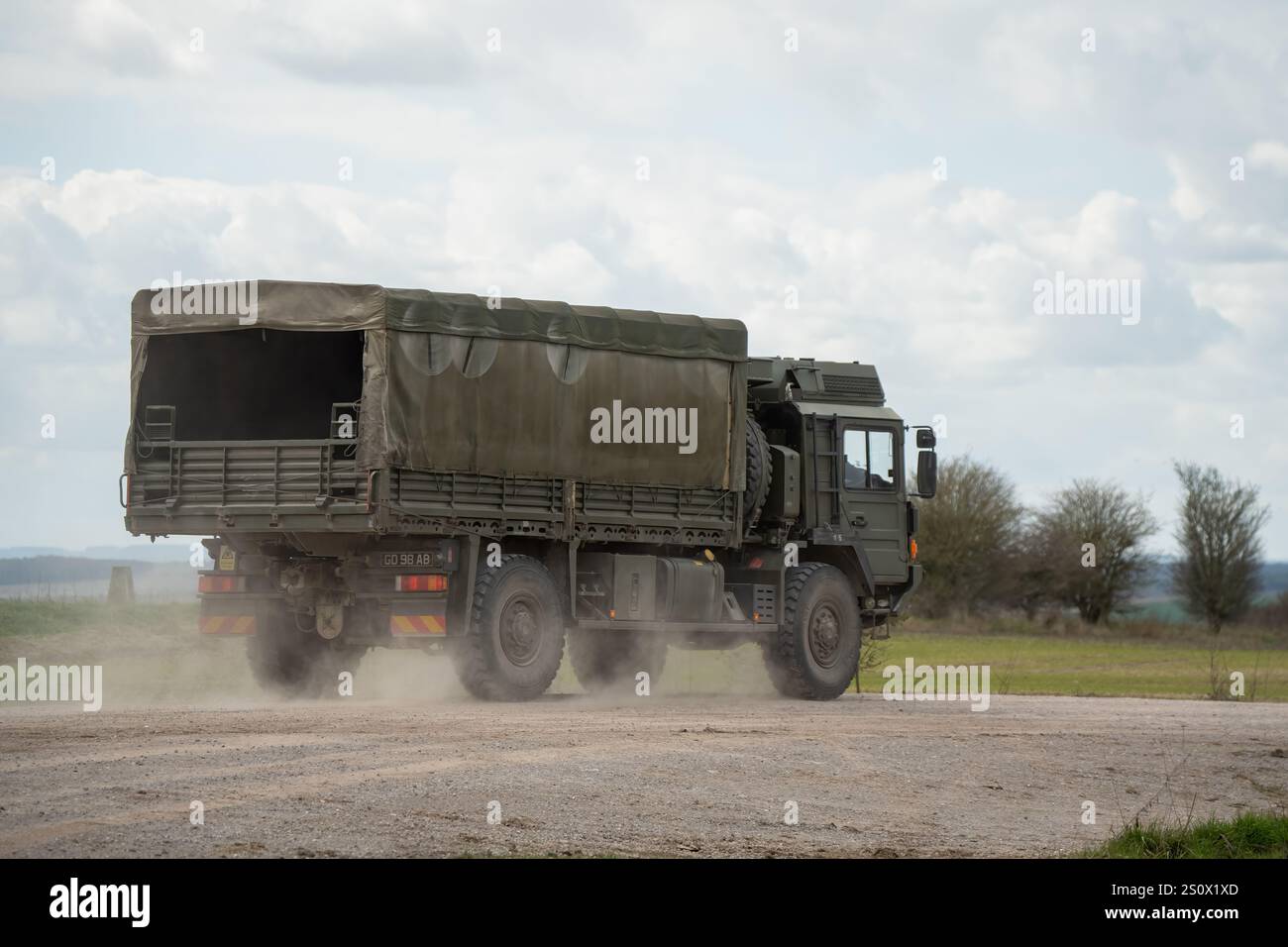 British army MAN SV 4x4 logistics truck, driving an unmade road, in ...