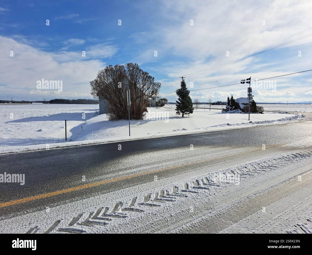 Quebec flag flying in Saint-Simon, Quebec, Canada Stock Photo - Alamy