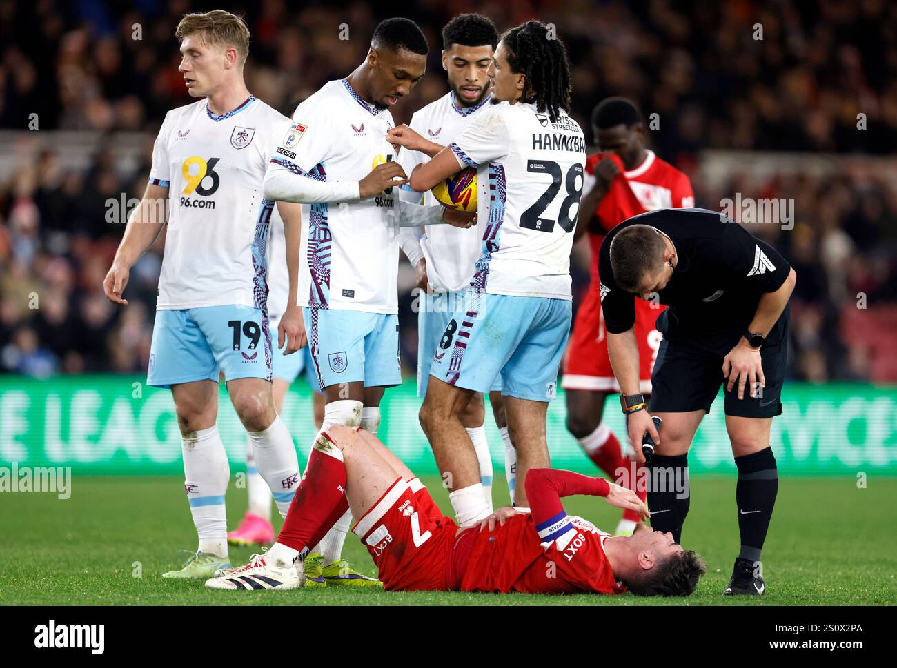 Referee Josh Smith speaks to Middlesbrough's Hayden Hackney after a ...