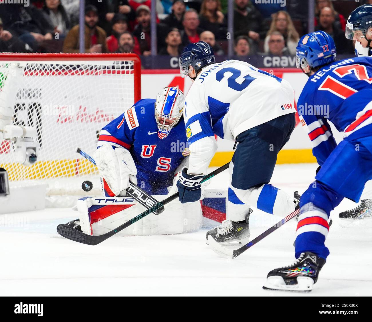 United States goaltender Trey Augustine (1) makes a save against ...