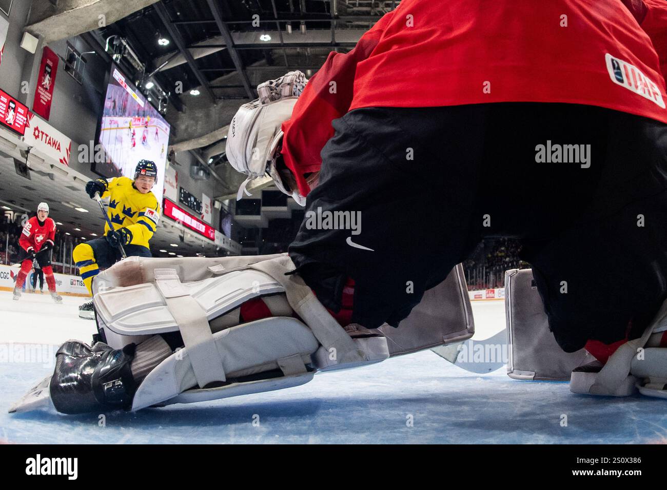 Zeb Forsfjäll of, Sweden. , . score 1-2 behind goaltender Elijah ...