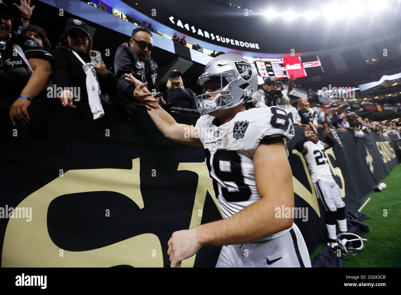 Las Vegas Raiders tight end Brock Bowers (89) celebrates with fans ...