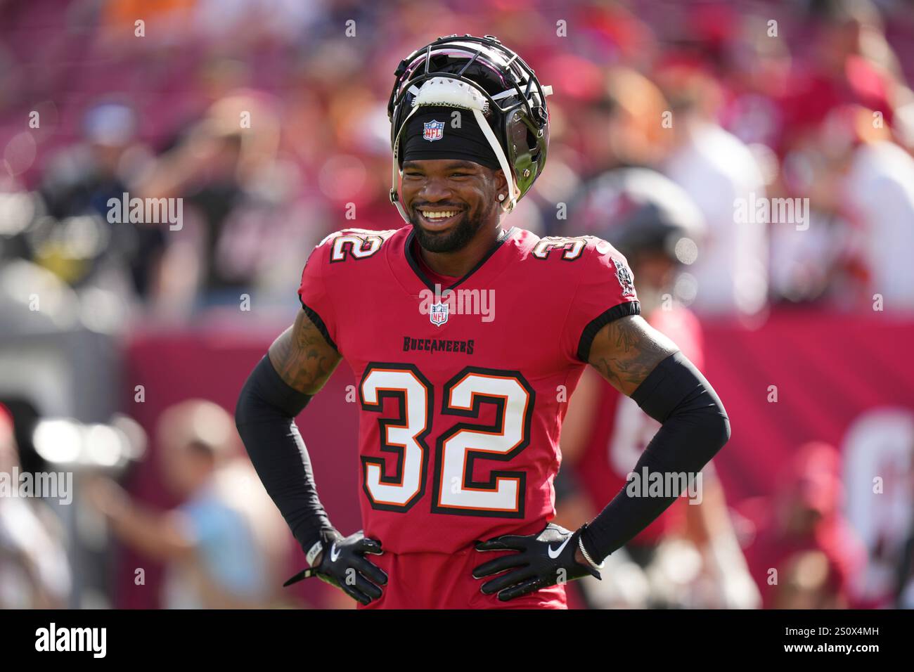 Tampa Bay Buccaneers safety Josh Hayes (32) smiles at a teammate before ...