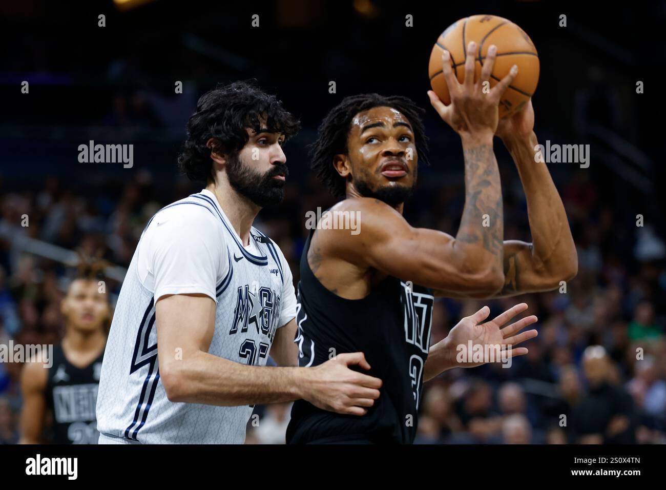 Orlando Magic center Goga Bitadze, front left, defends against Brooklyn ...