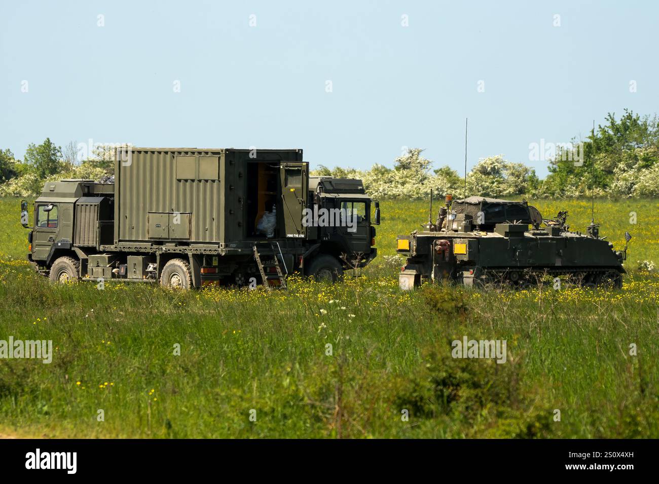 British army MAN SV 4x4 Heavy Utility logistics trucks with a Bulldog ...
