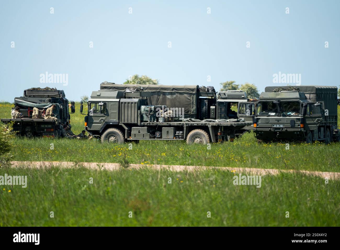 British army MAN SV 4x4 Heavy Utility logistics trucks with a Bulldog ...