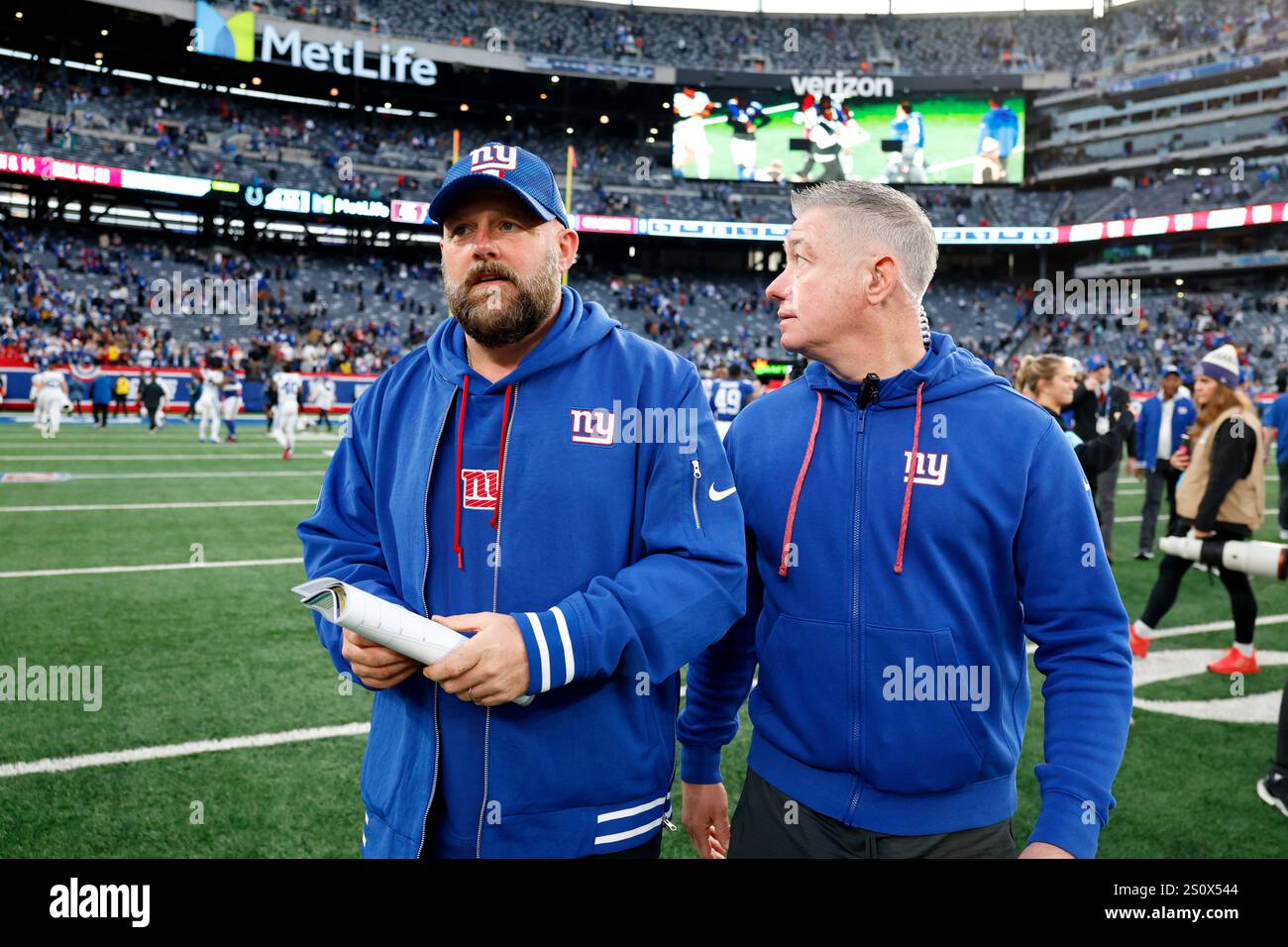 New York Giants head coach Brian Daboll, left, leaves the field after ...