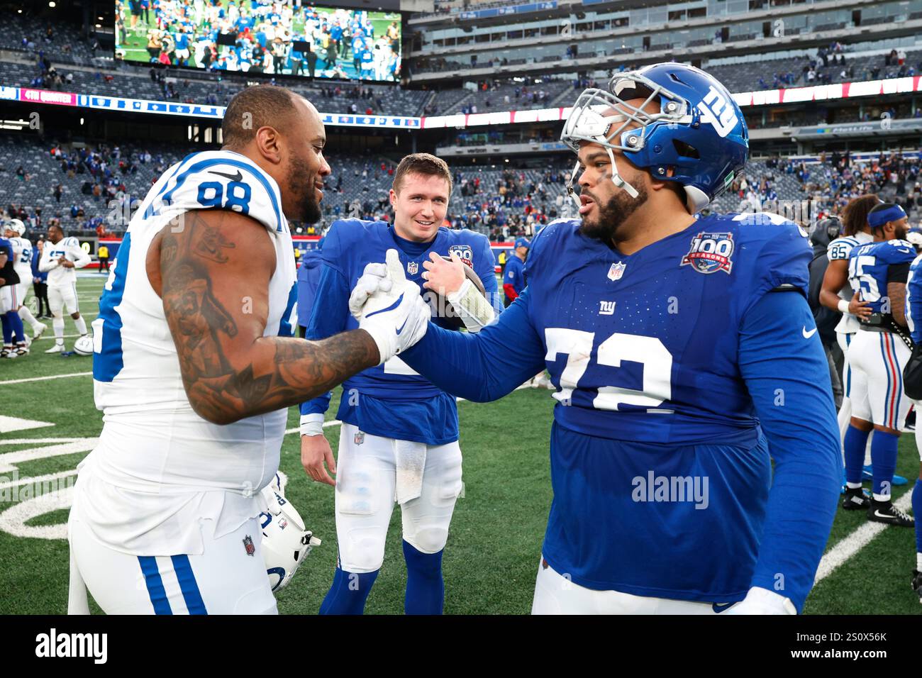 Indianapolis Colts defensive tackle Raekwon Davis (98) shakes hands ...
