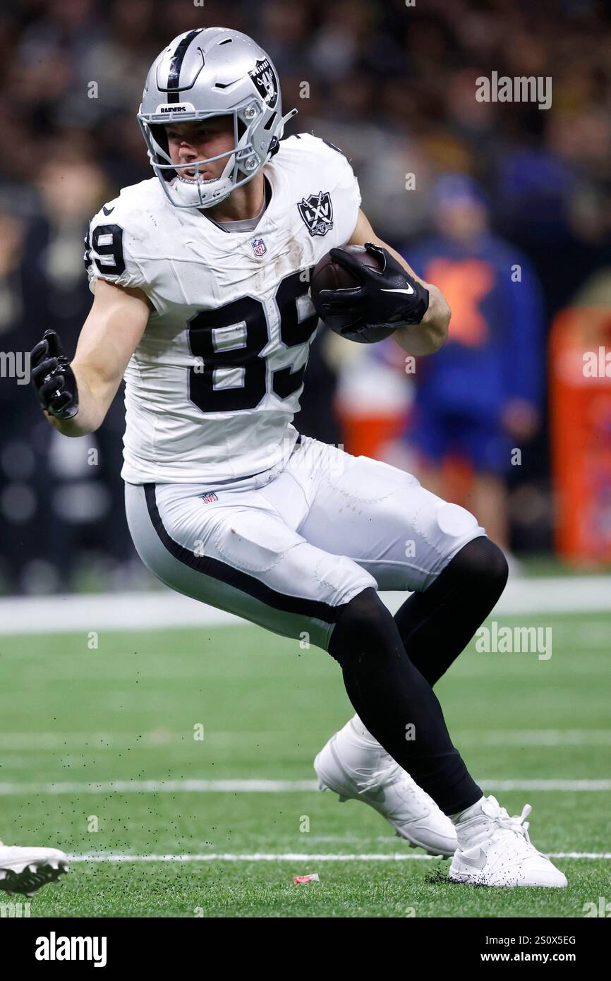 Las Vegas Raiders tight end Brock Bowers runs up field after catching a ...