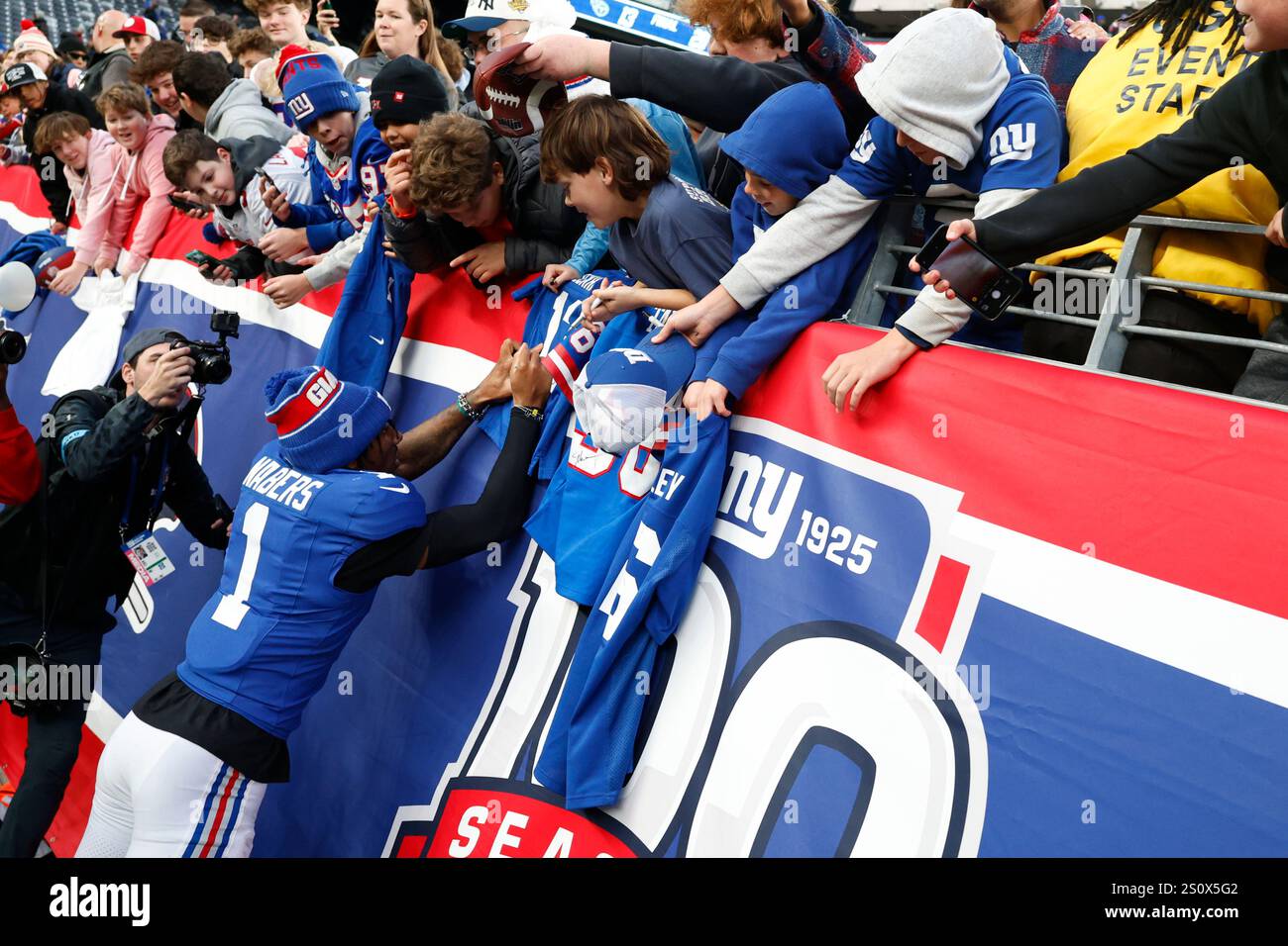 New York Giants wide receiver Malik Nabers (1) signs autographs after ...
