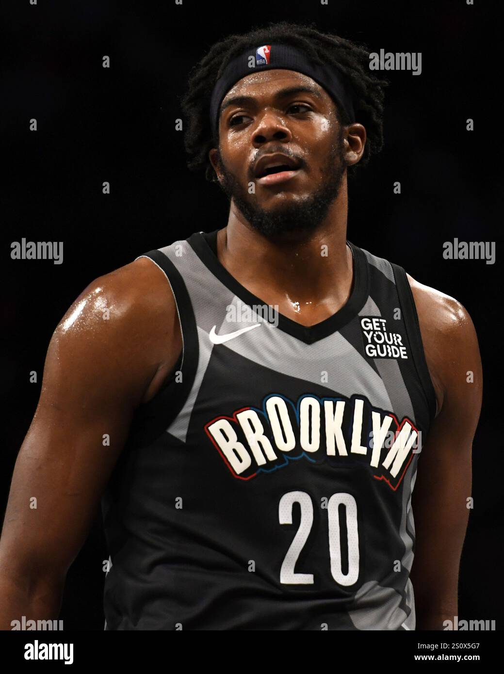 Brooklyn Nets' Day'Ron Sharpe stands on the court during the first half ...