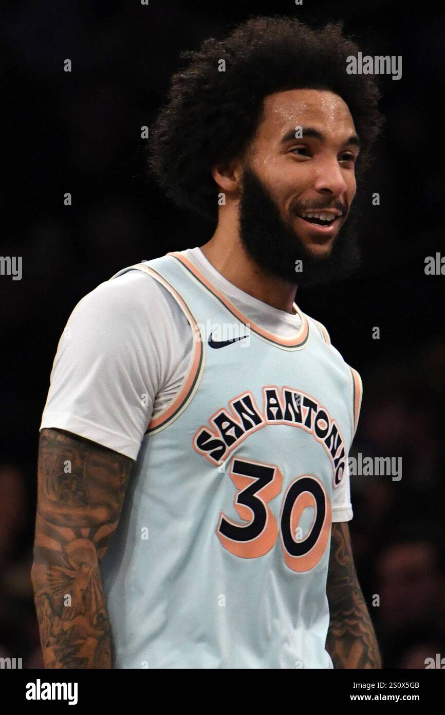 San Antonio Spurs' Julian Champagnie stands on the court during the ...