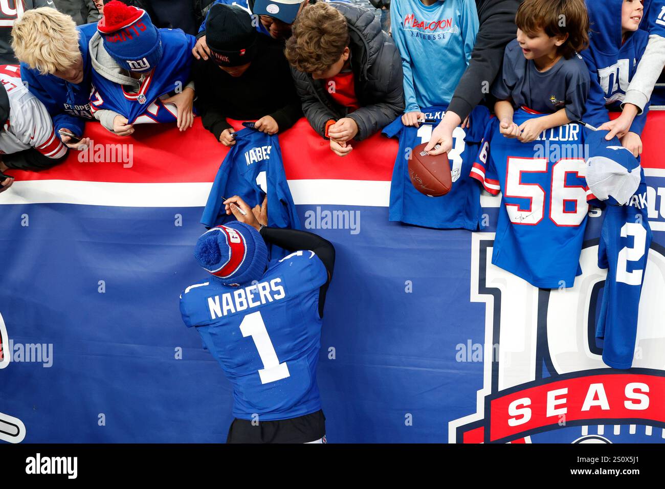 New York Giants wide receiver Malik Nabers signs autographs after an ...
