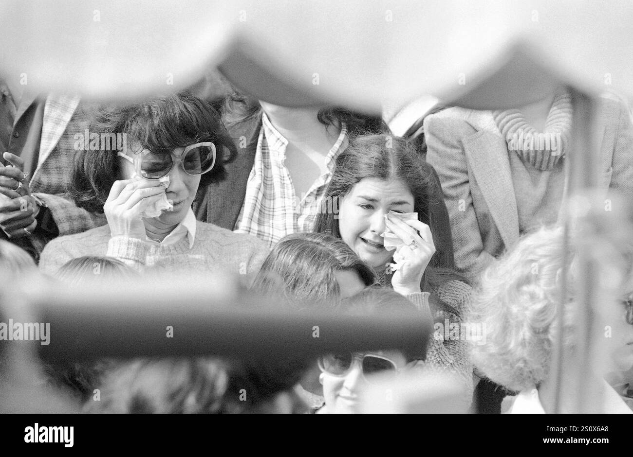 FILE - Members of President Jimmy Carter's staff cry as the President ...