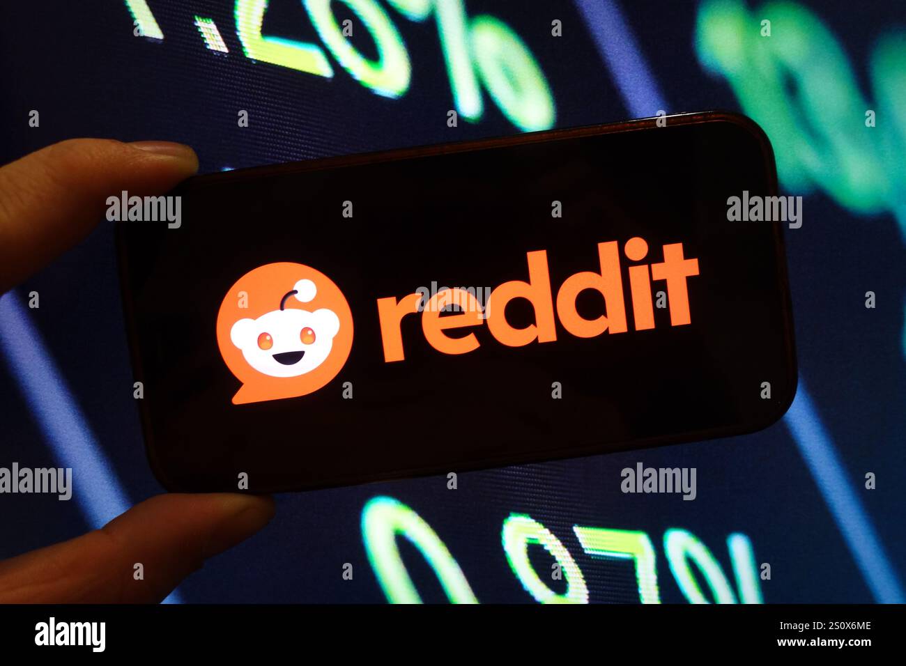 In this photo illustration, the Reddit company logo is seen displayed ...