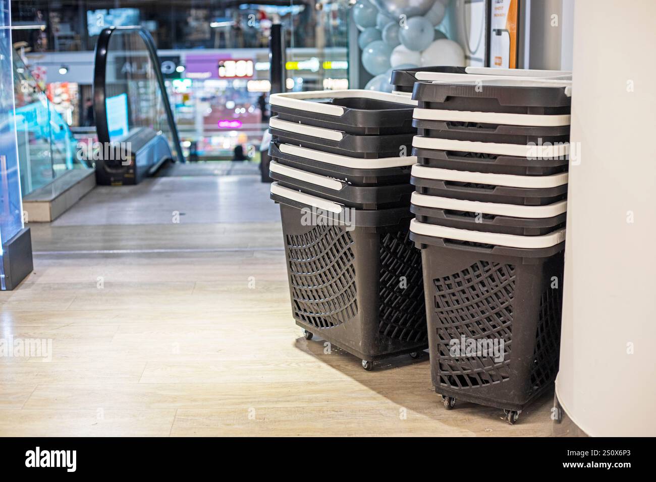 black shopping carts for clothes in supermarket Stock Photo - Alamy