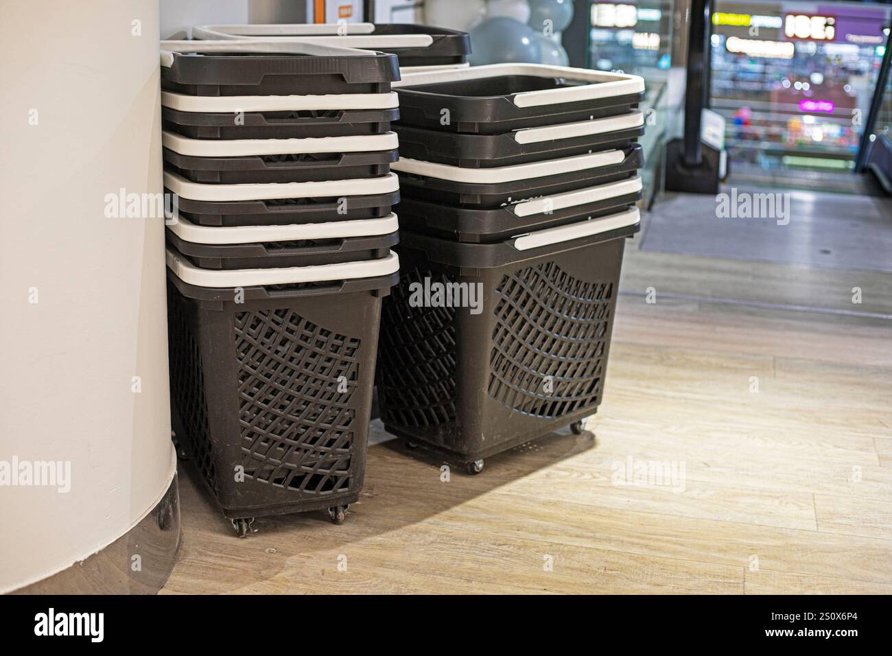 black shopping carts for clothes in supermarket Stock Photo - Alamy