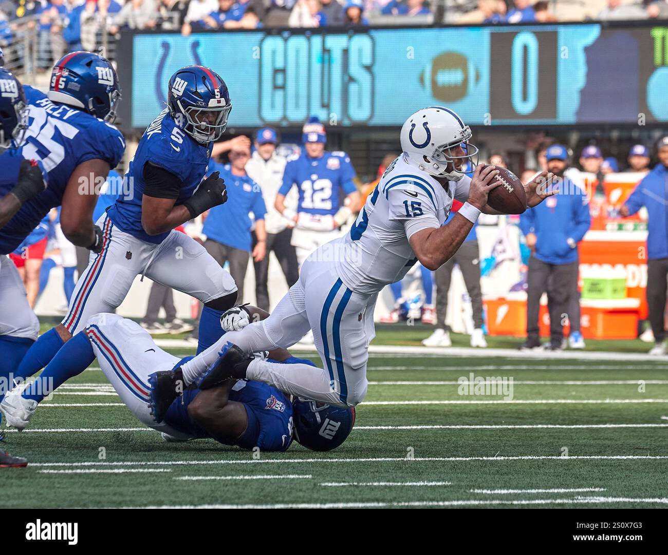 Indianapolis Colts quarterback Joe Flacco (15) is talked while ...