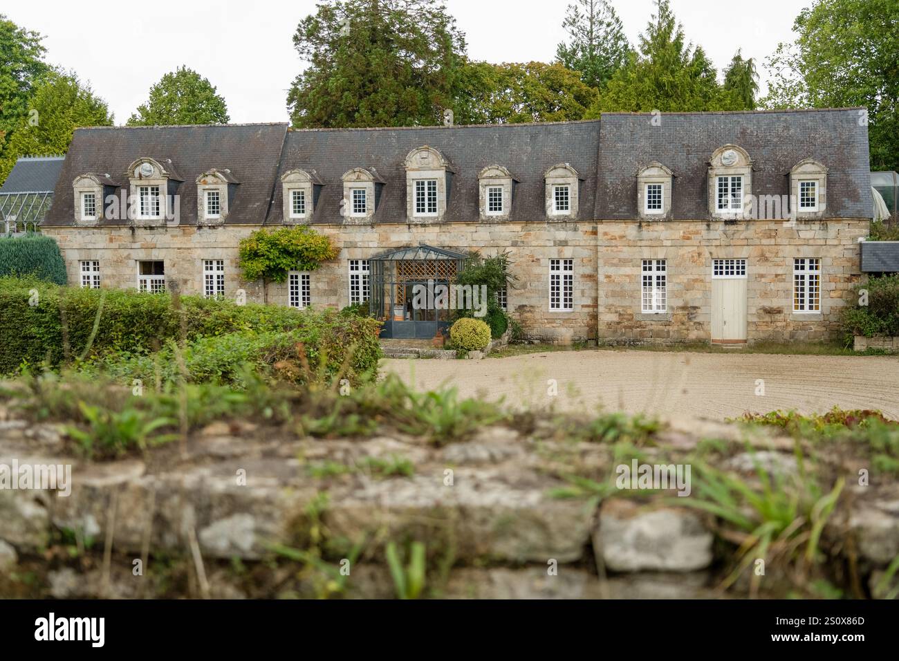 converted accommodation stables in beige stone at Chateau de Kergrist ...