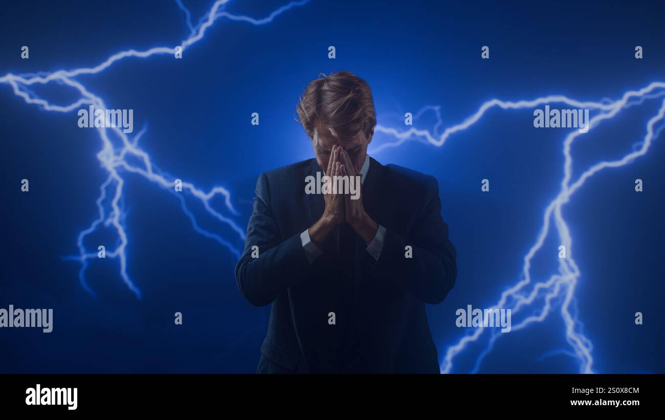 A man in a business suit is stressed. A businessman is tense. Electric ...