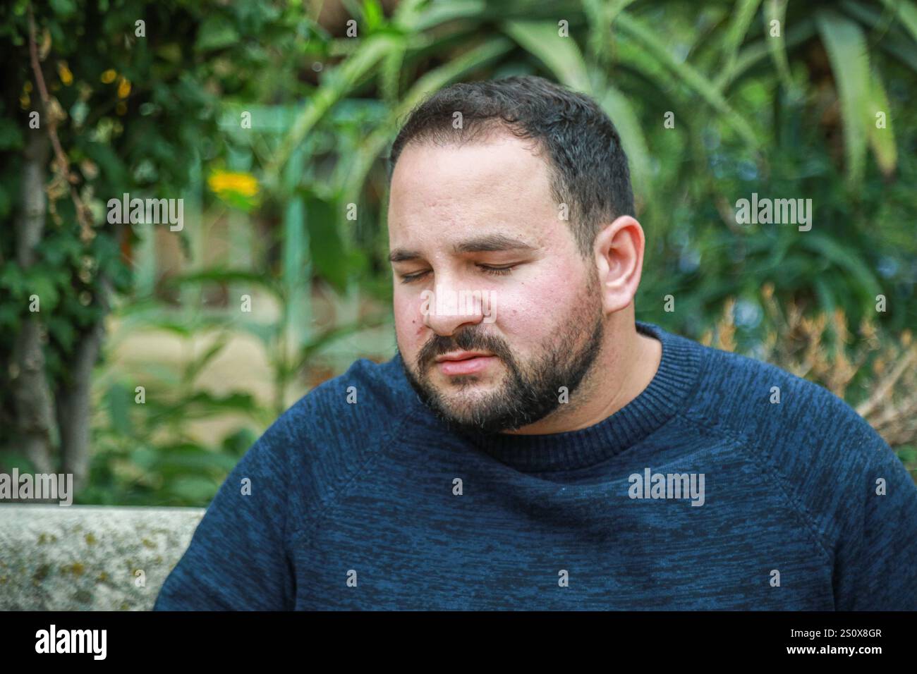 Tired Man Closing His Eyes On The Bench Stock Photo - Alamy