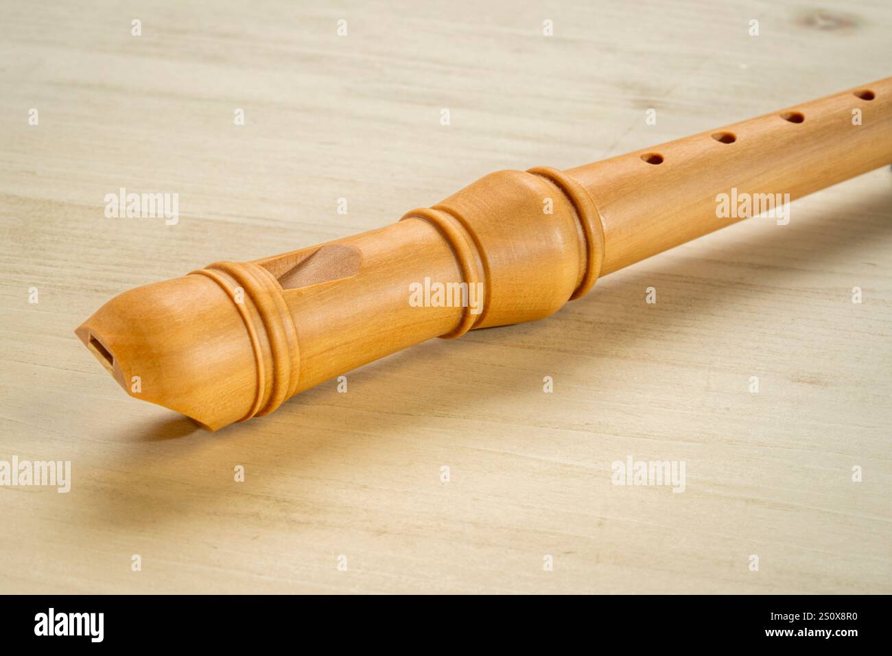 wooden recorder flute instrument, classic German style, against wood ...