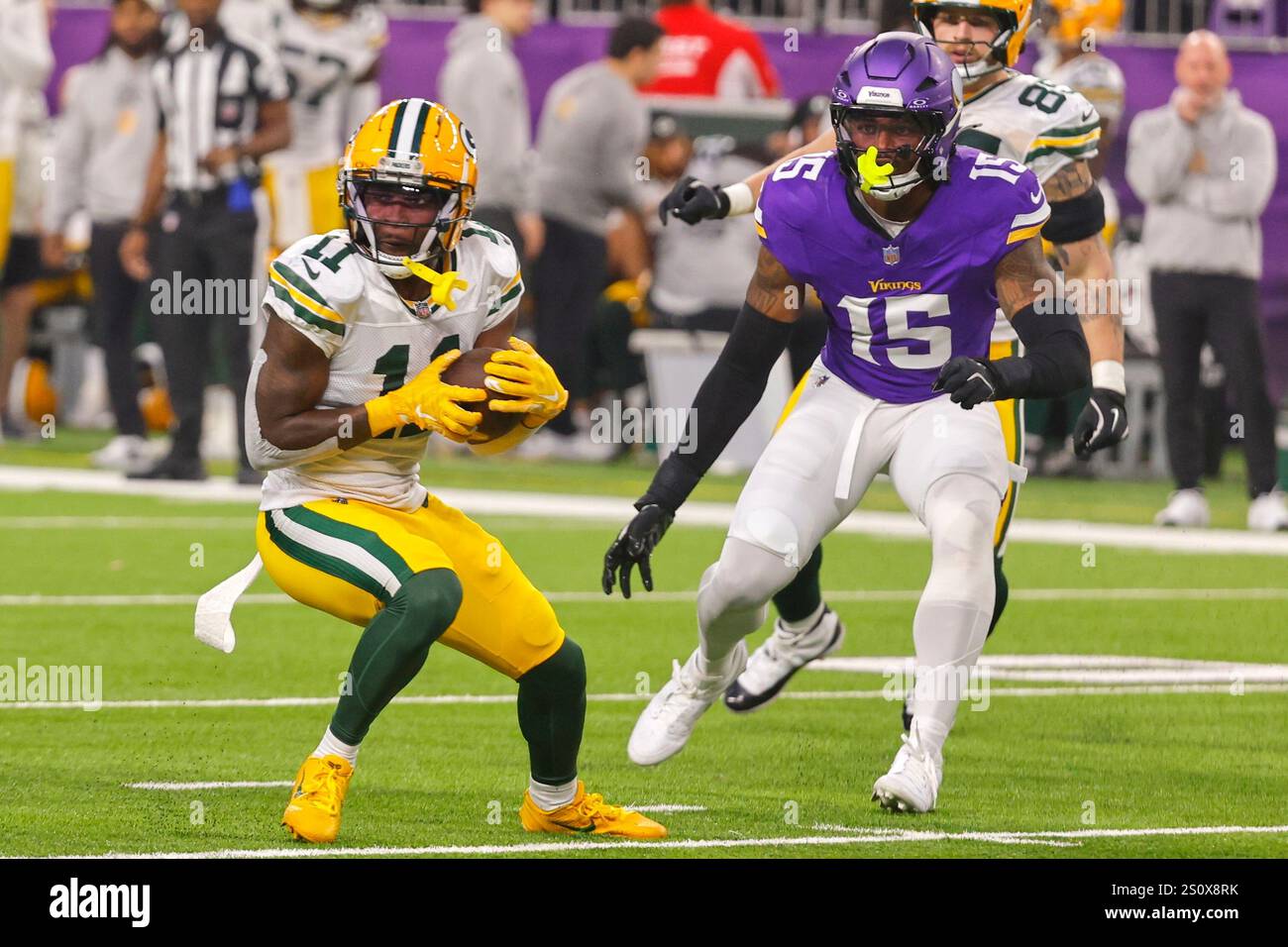 Green Bay Packers' Jayden Reed catches a pass in front of Minnesota ...