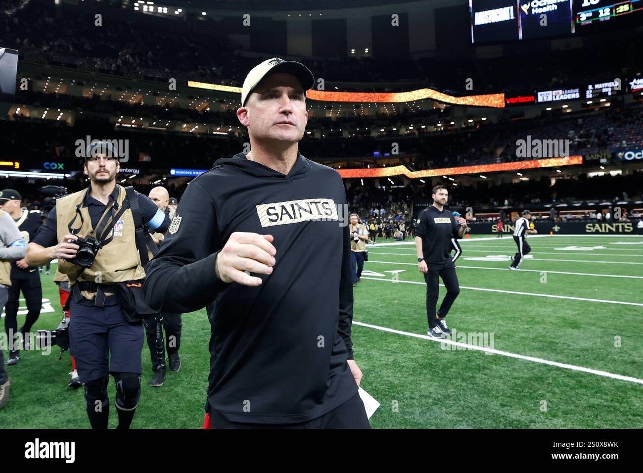 New Orleans Saints interim head coach Darren Rizzi walks across the ...