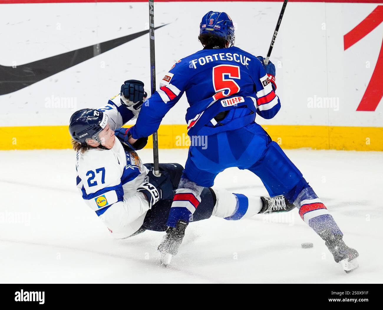 Ottawa, Can. 29th Dec, 2024. USA's Drew Fortescue (5) pushes Finland's ...