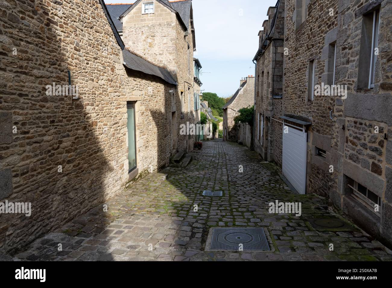 view between old stone walls and buildings of a beautifully preserved ...