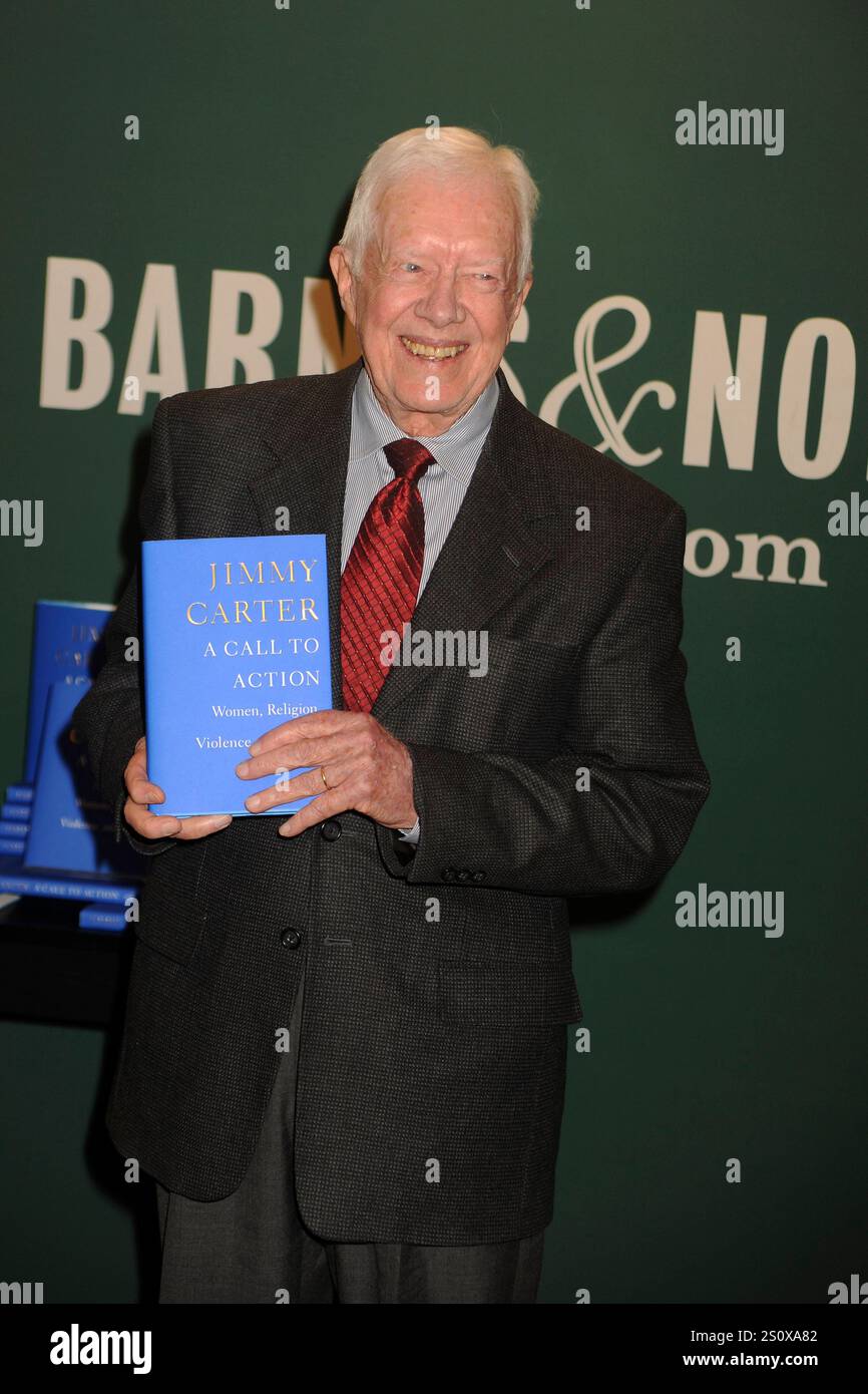Former US President Jimmy Carter signs copies of his new book 'A Call ...