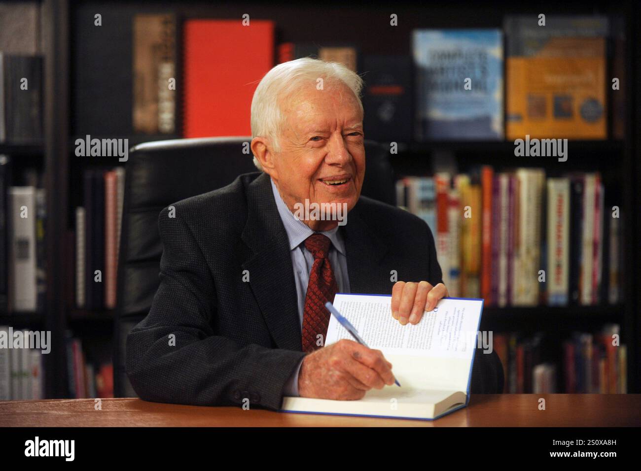 Former US President Jimmy Carter signs copies of his new book 'A Call ...