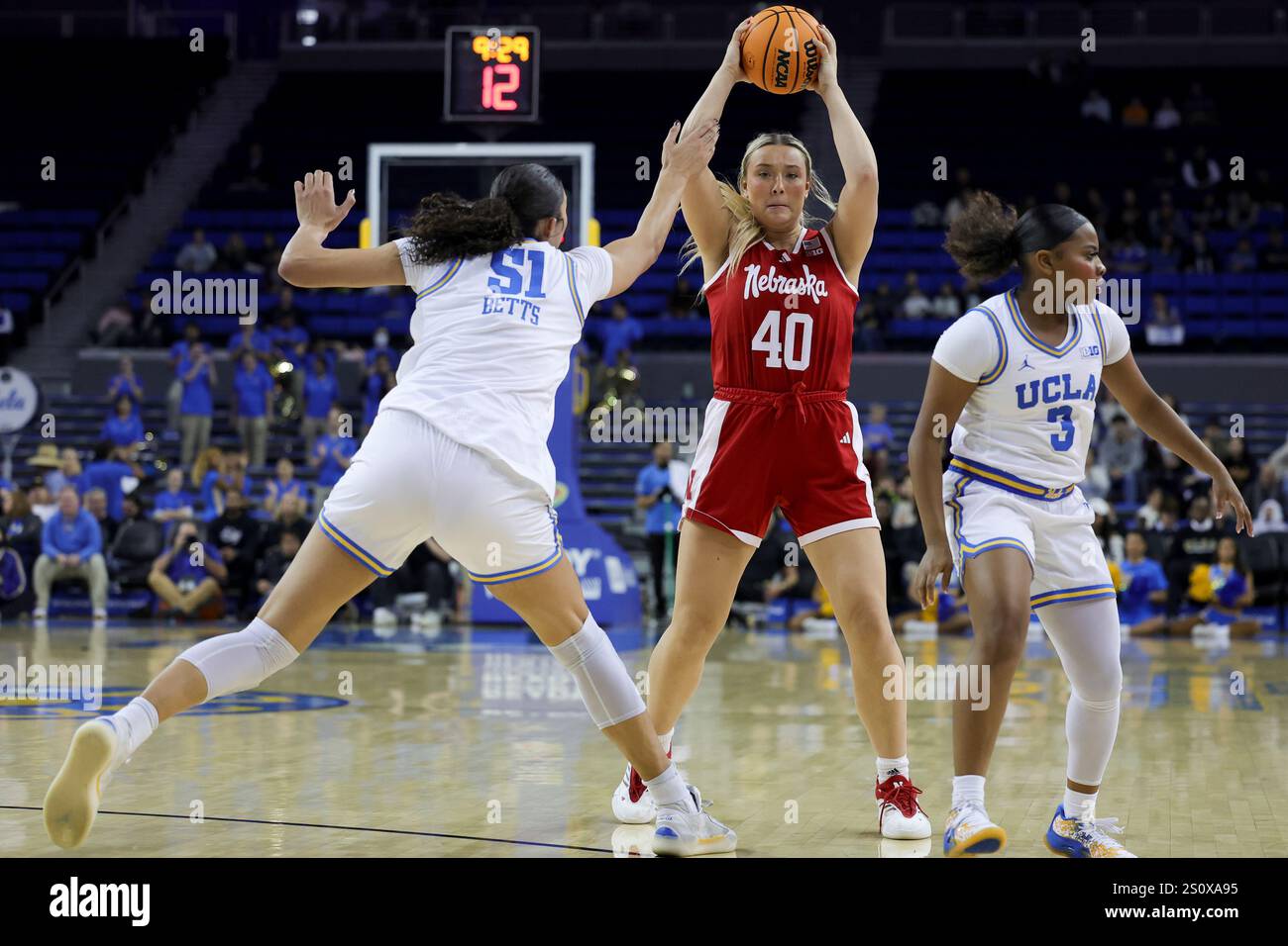 Nebraska center Alexis Markowskim, center, is guarded by UCLA center ...