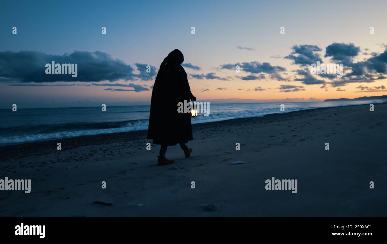 Silent Footsteps Trail Across the Wet Sand Stock Photo - Alamy