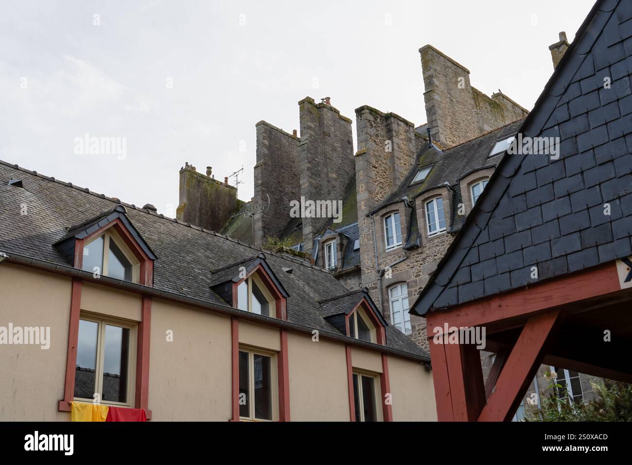 view between old stone walls and buildings of a beautifully preserved ...