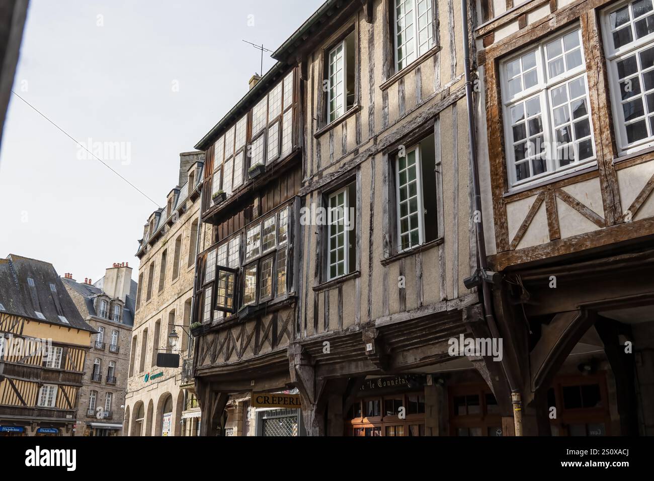 view between old stone walls and buildings of a beautifully preserved ...