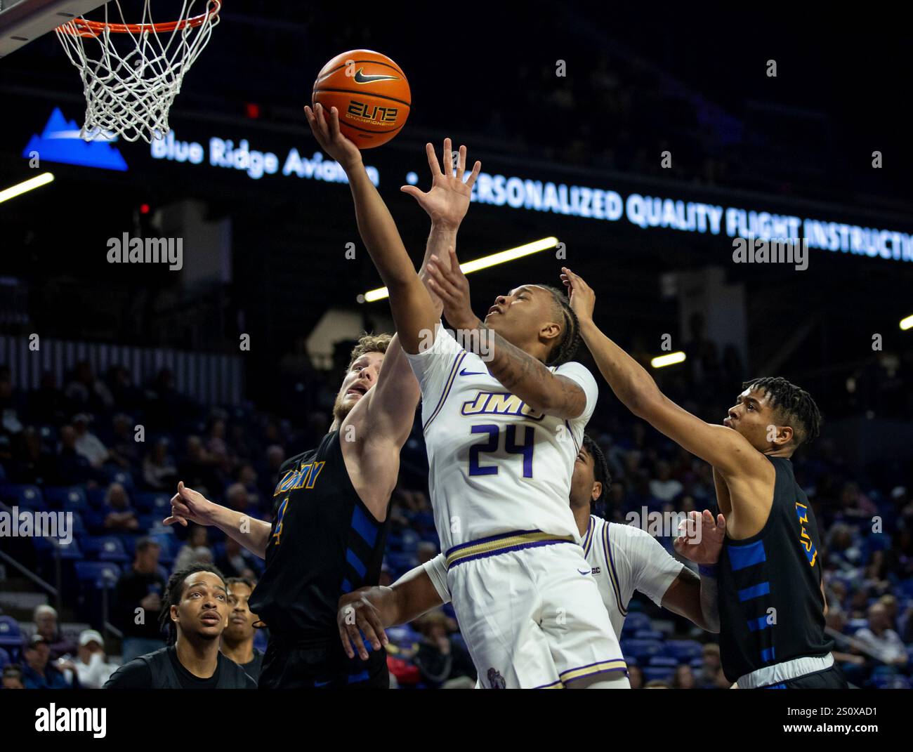 James Madison guard Redd Thompson Jr. (24) takes a shot against Midway ...