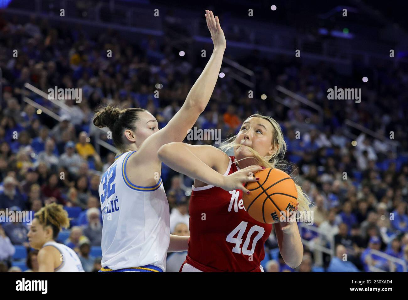Nebraska center Alexis Markowski, right, looks to shoot against UCLA ...