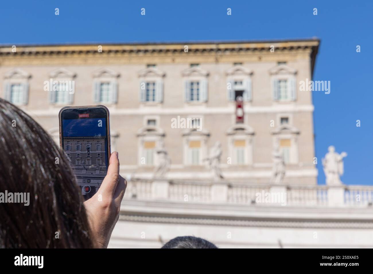 Rome, Italy. 29th Dec, 2024. Faithful listen to the Angelus of Pope ...