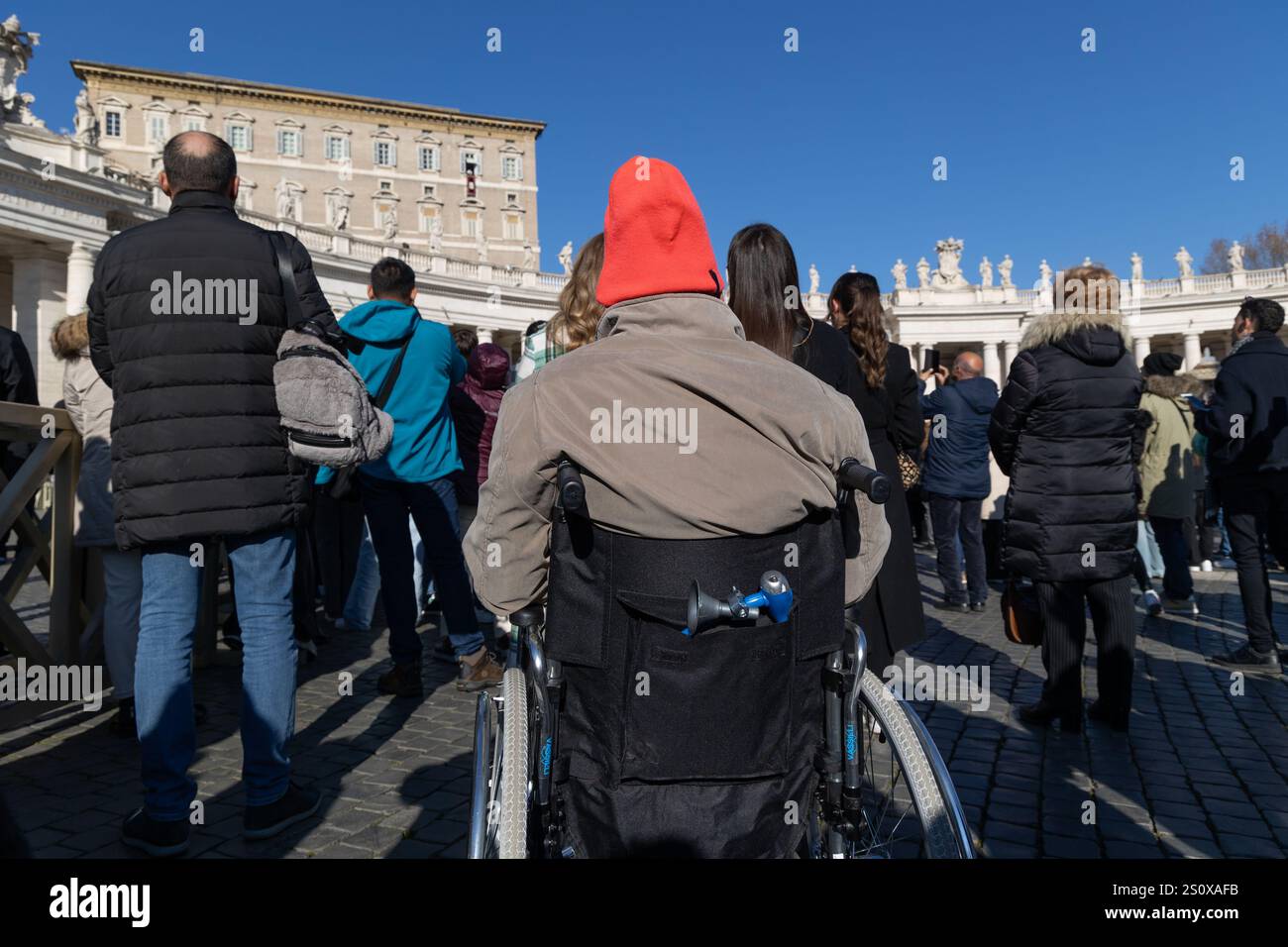 Rome, Italy. 29th Dec, 2024. Faithful listen to the Angelus of Pope ...