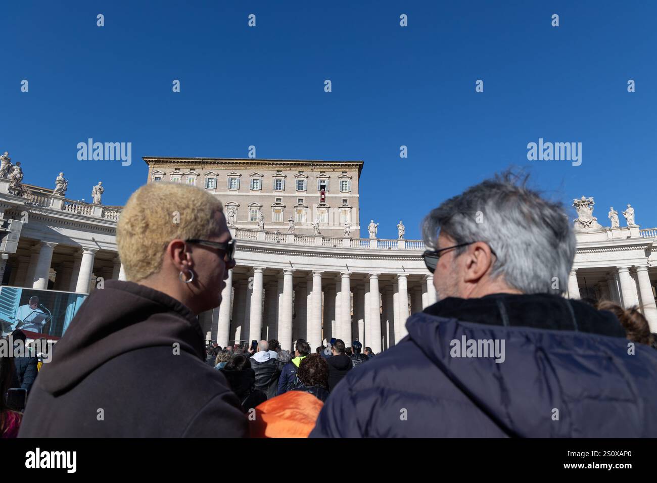 Rome, Italy. 29th Dec, 2024. Faithful listen to the Angelus of Pope ...
