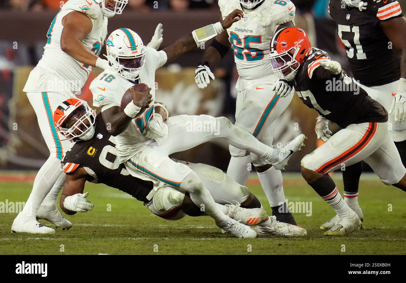 Miami Dolphins quarterback Tyler Huntley (18) is sacked by Cleveland ...