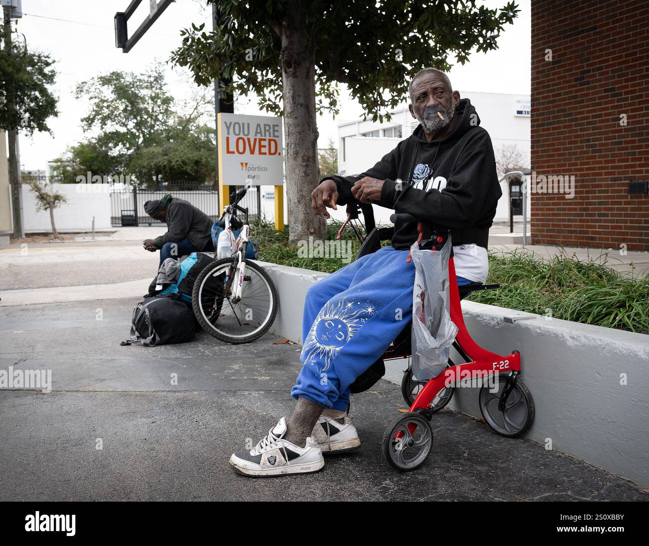 Tampa, Florida, USA. 29th Dec, 2024. a Homeless man rests outside Tampa ...