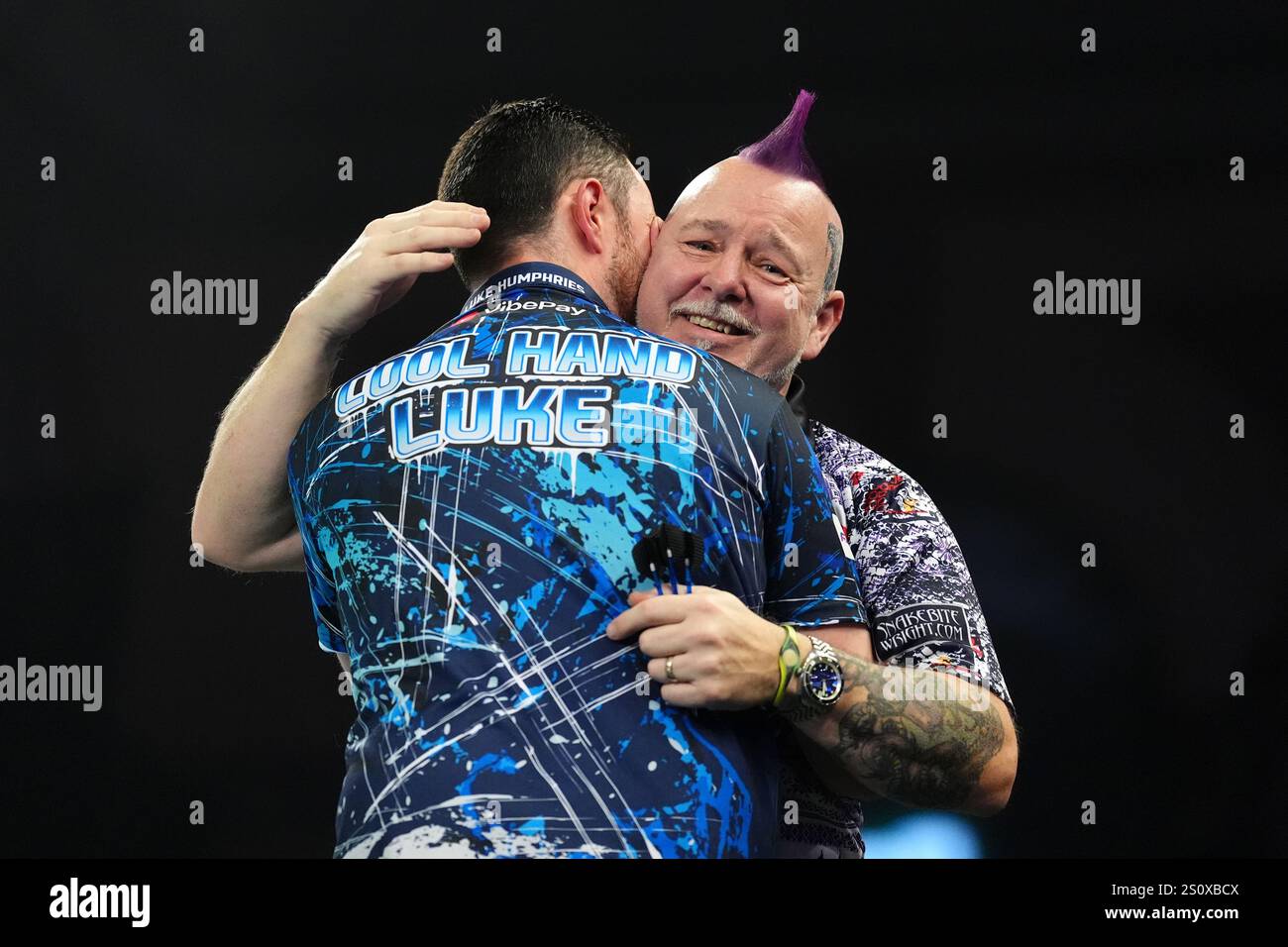 Peter Wright reacts after winning his fourth round match against Luke ...