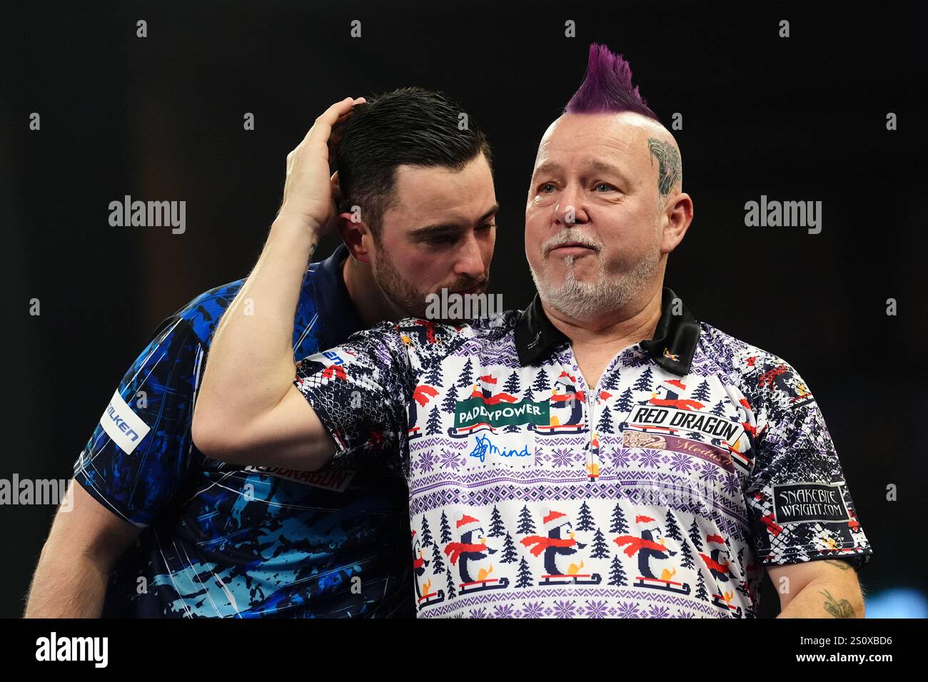 Peter Wright reacts after winning his fourth round match against Luke ...