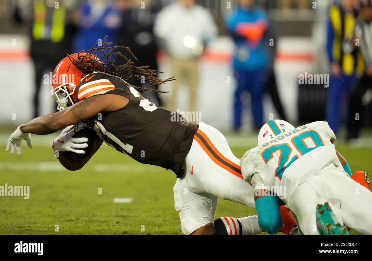 Cleveland Browns running back D'Onta Foreman, left, is tackled by Miami ...