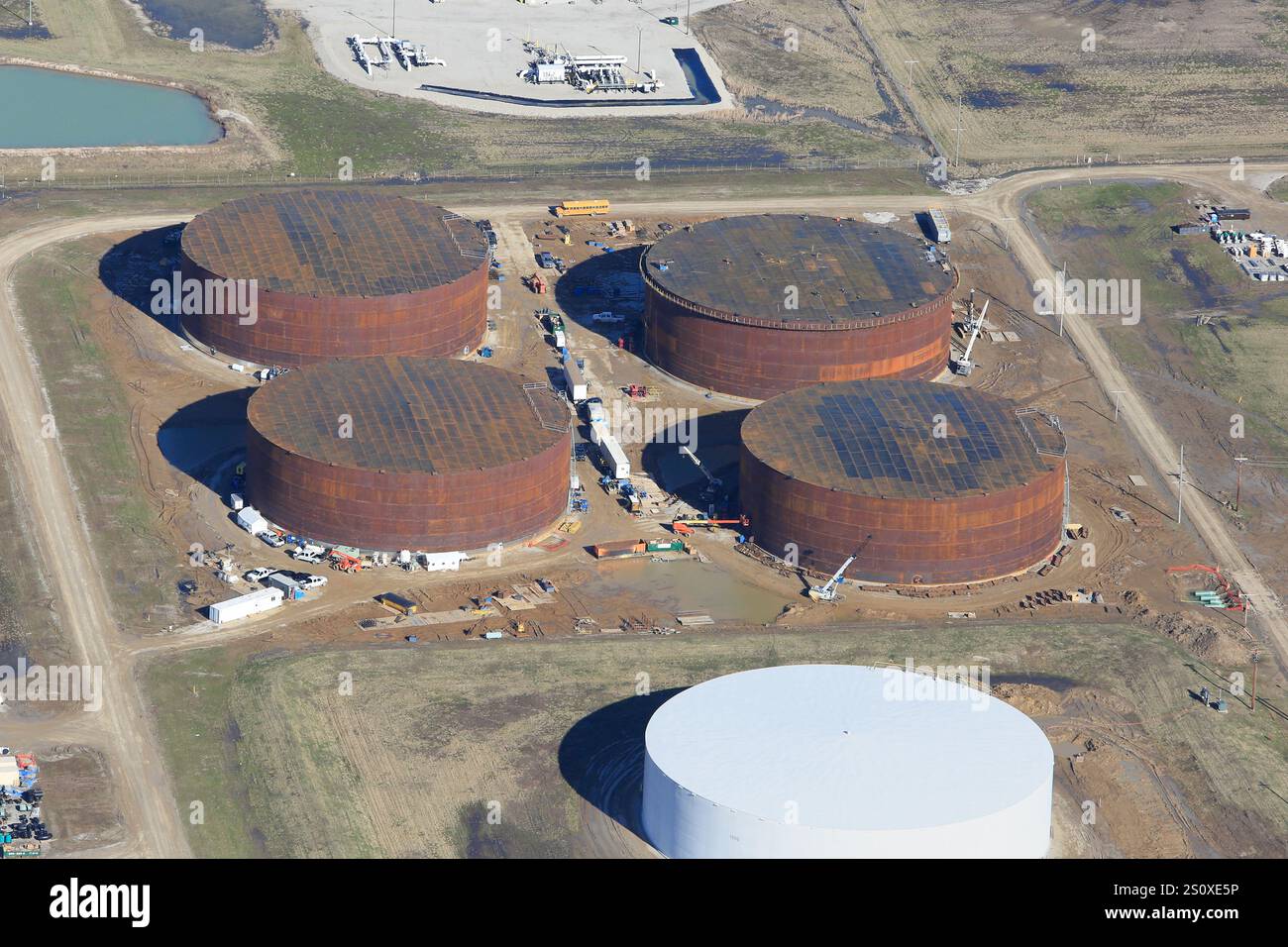 Aerial view of petroleum storage tanks under construction at an oil ...