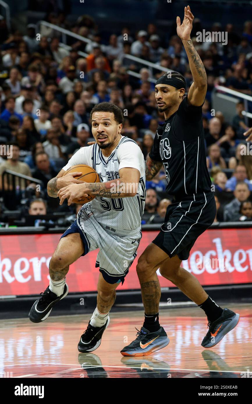 Orlando Magic guard Cole Anthony (50) drives around Brooklyn Nets guard ...