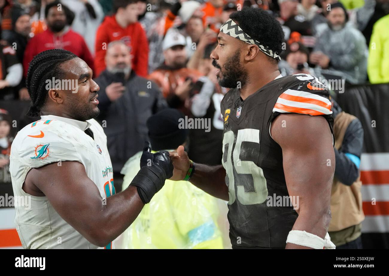 Miami Dolphins linebacker Tyrel Dodson, left, meets Cleveland Browns ...