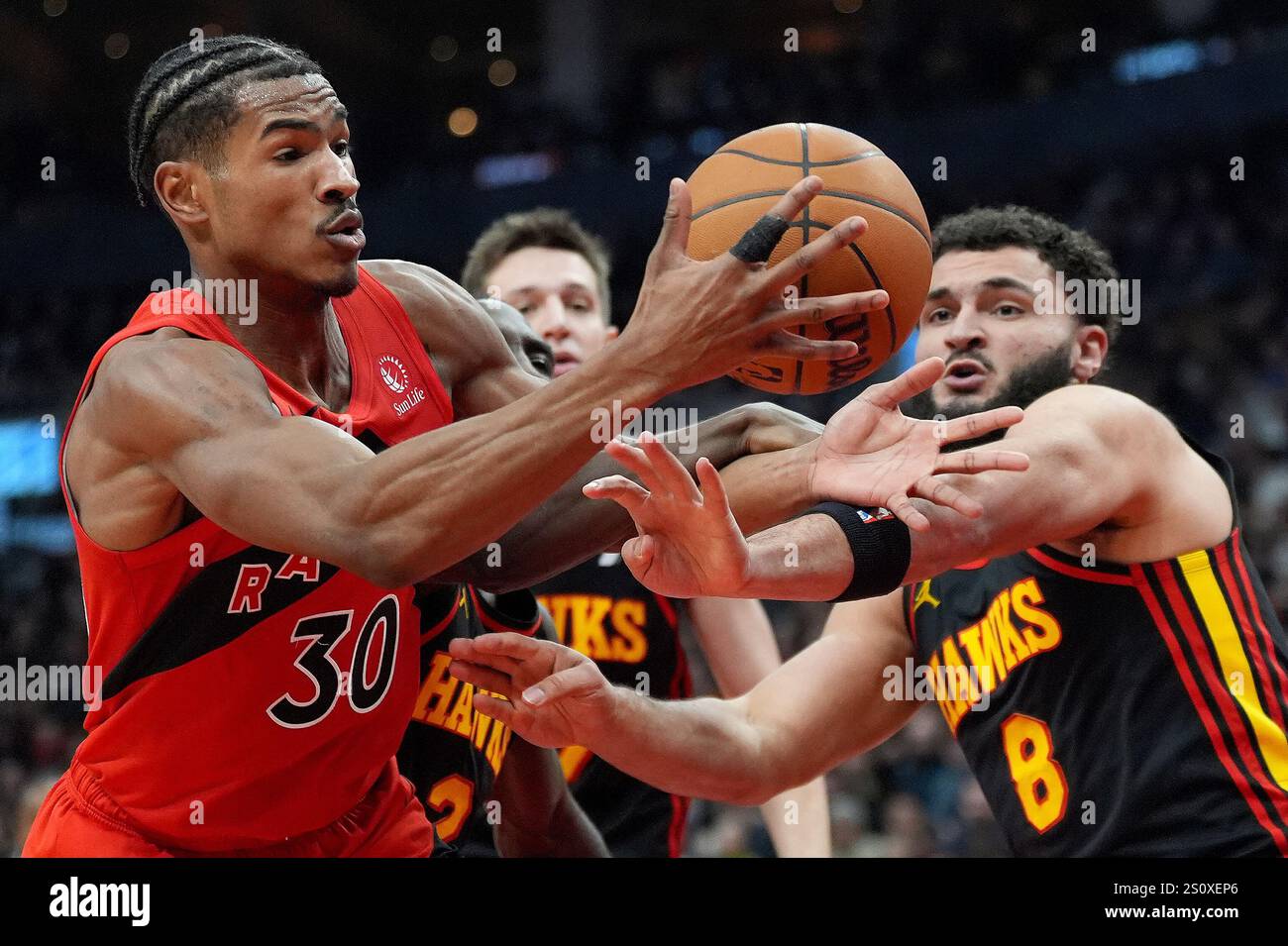 Toronto Raptors guard Ochai Agbaji (30) vies for a rebound with Atlanta ...